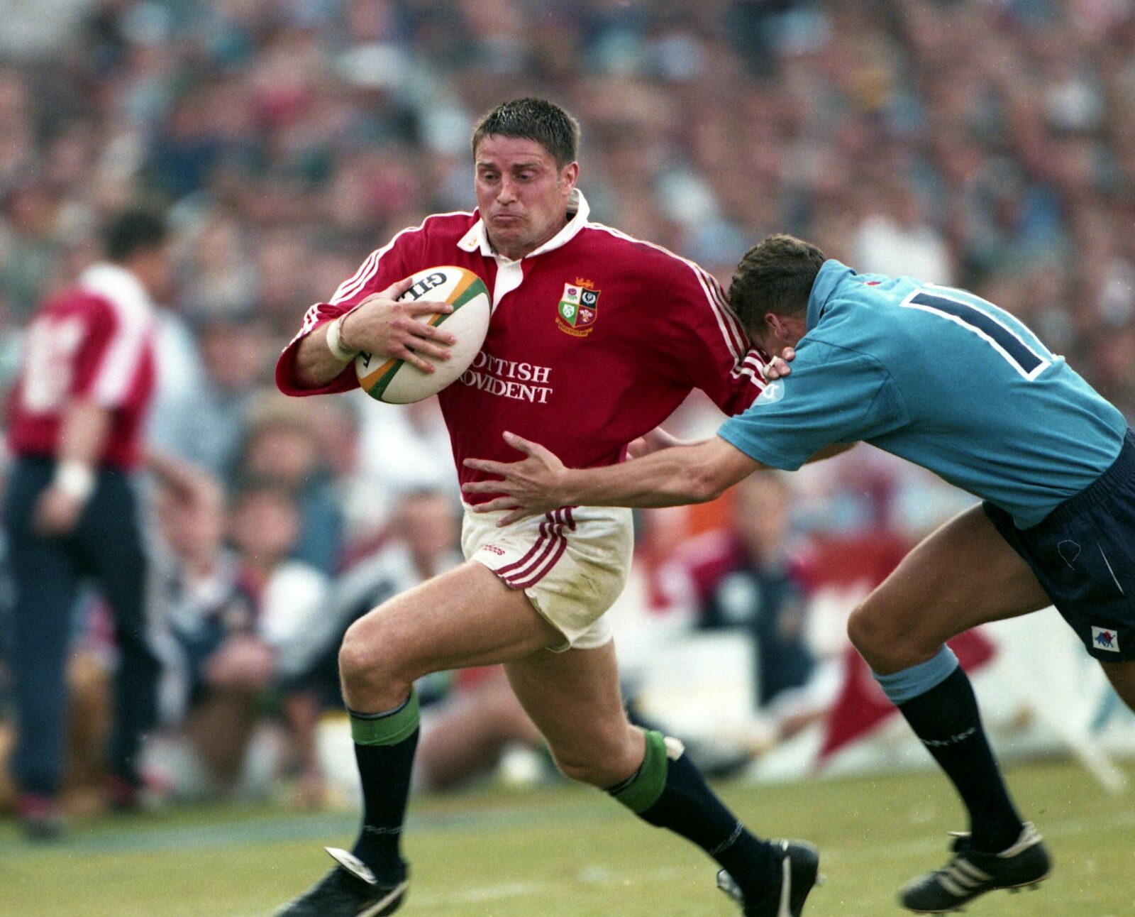 British & Irish Lions | Alan Tait evades a tackle 1997